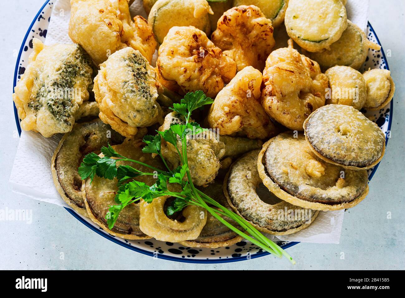 Deep frying vegetables in a plate on the table. vegan option Stock ...