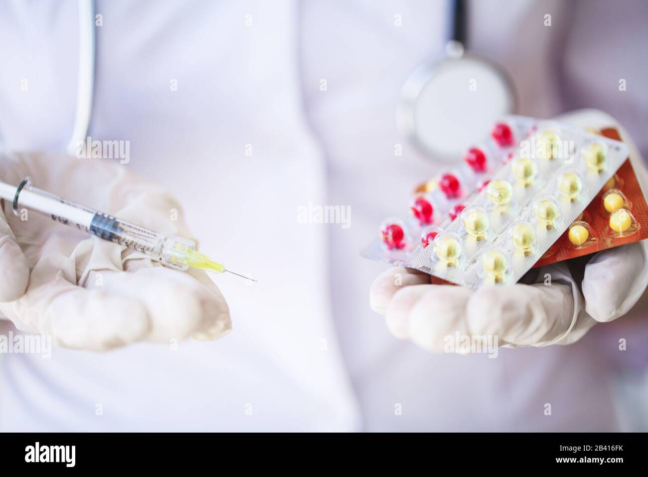 Woman doctor shaking in hands a syringe full Stock Photo - Alamy