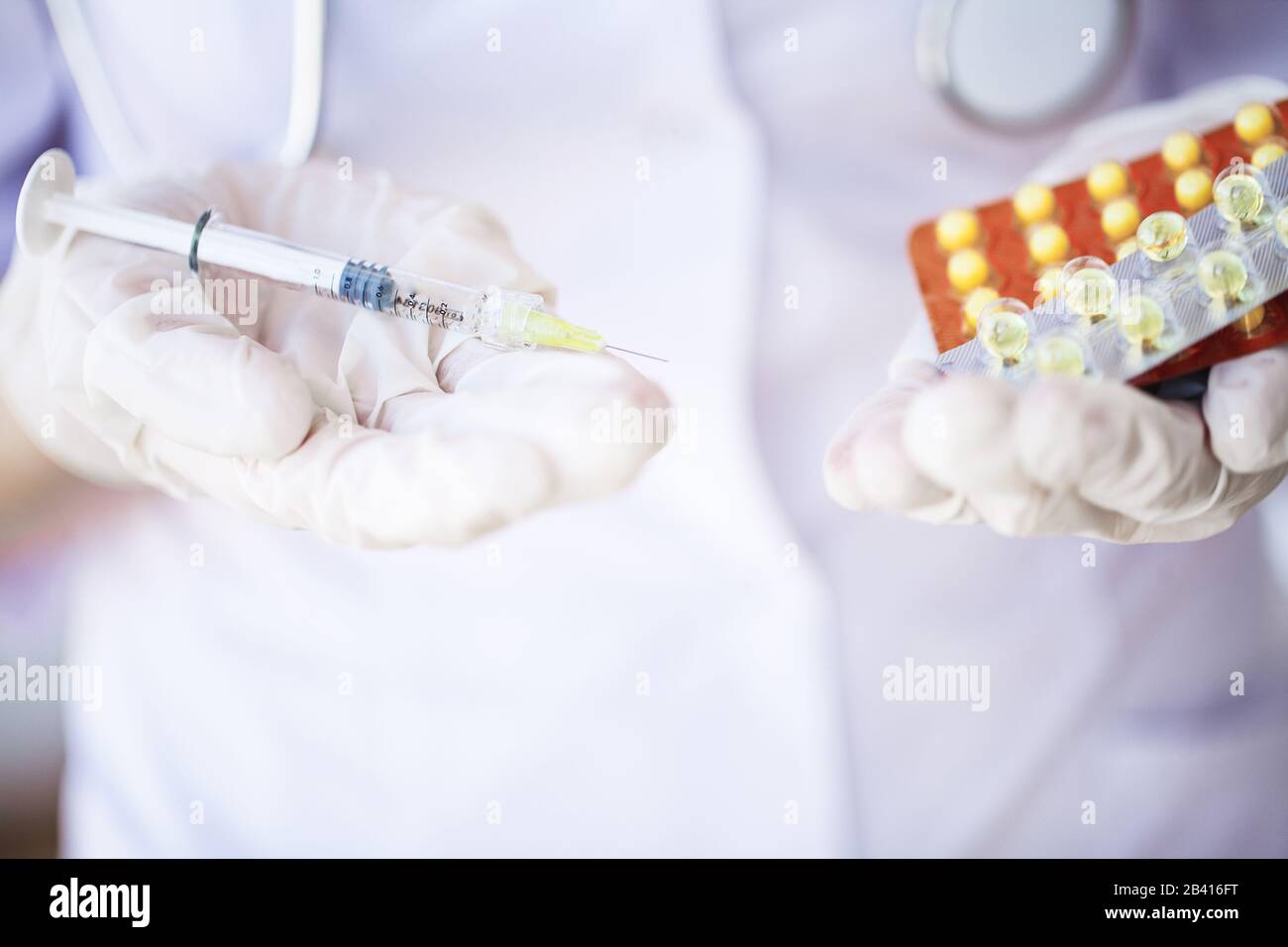 Woman doctor shaking in hands a syringe full Stock Photo - Alamy