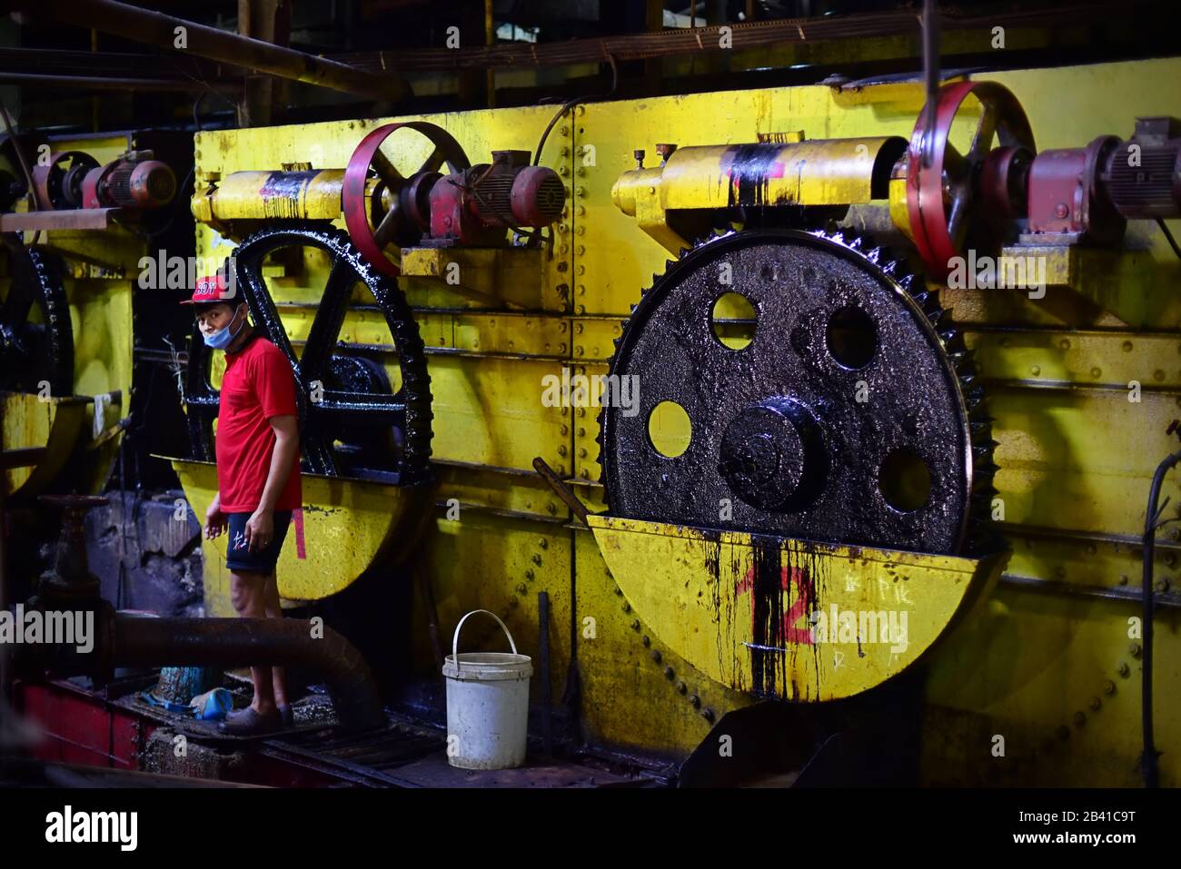 A factory worker photographed in front of sugar mill production ...