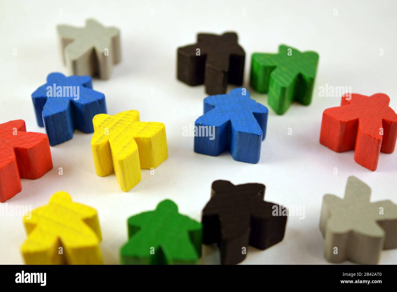 Colorful meeples on a white background. Strategy board game pieces ...