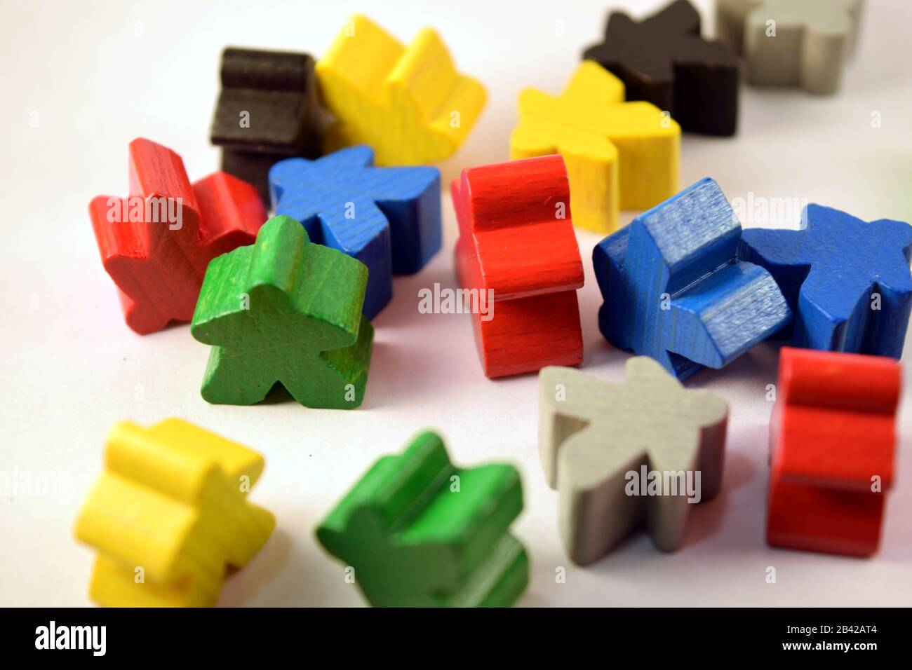 Colorful meeples on a white background. Strategy board game pieces ...