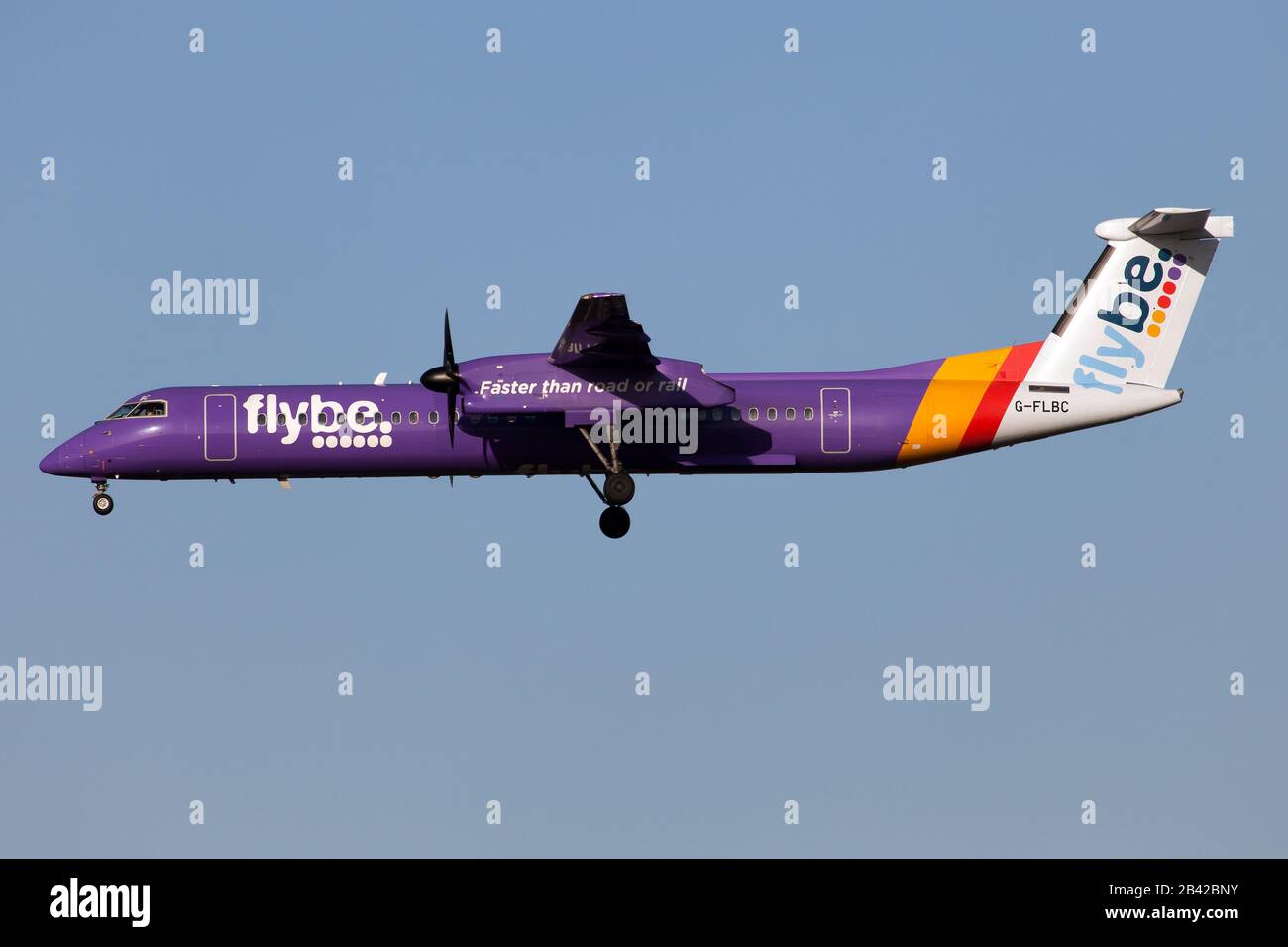 A Flybe Bombardier Dash 8-400 on final at London Heathrow airport. The ...
