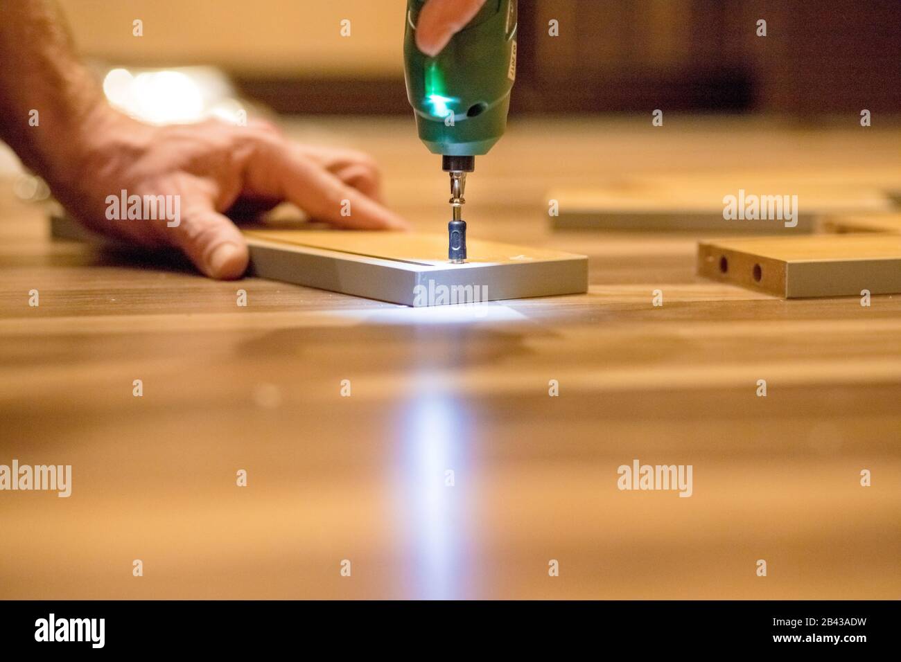 Man with screw gun or screwdriver, Building master, carpenter working ...