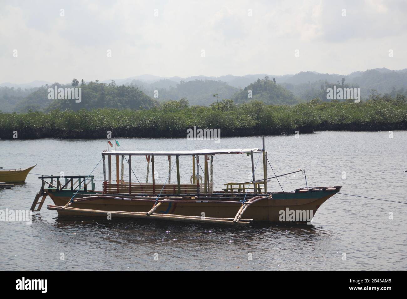 Big outrigger boat floating on a lagoon, Southern Philippines Stock ...
