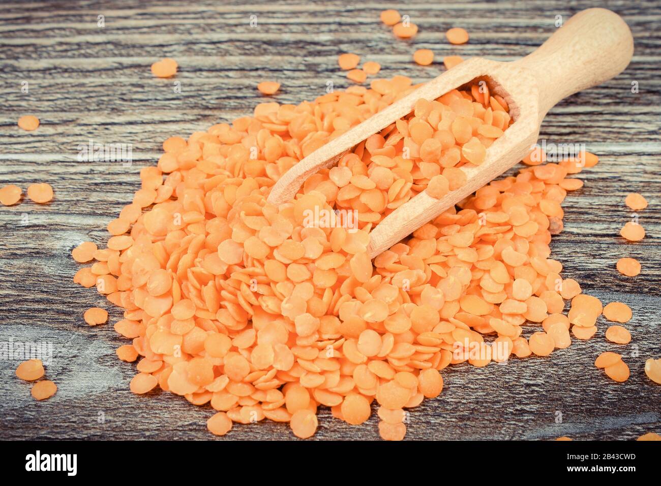 Heap of red lentil with wooden spoon. Healthy eating containing natural ...