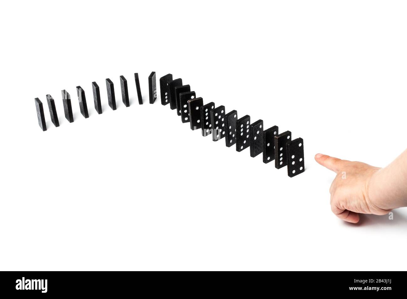 Child's hand pushes dice of dominoes isolated on white Stock Photo - Alamy