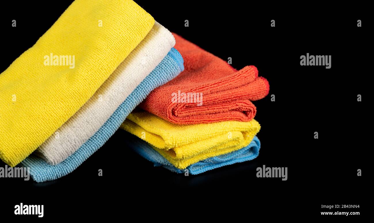 A pile of colorful shop rags shot against a black background Stock ...