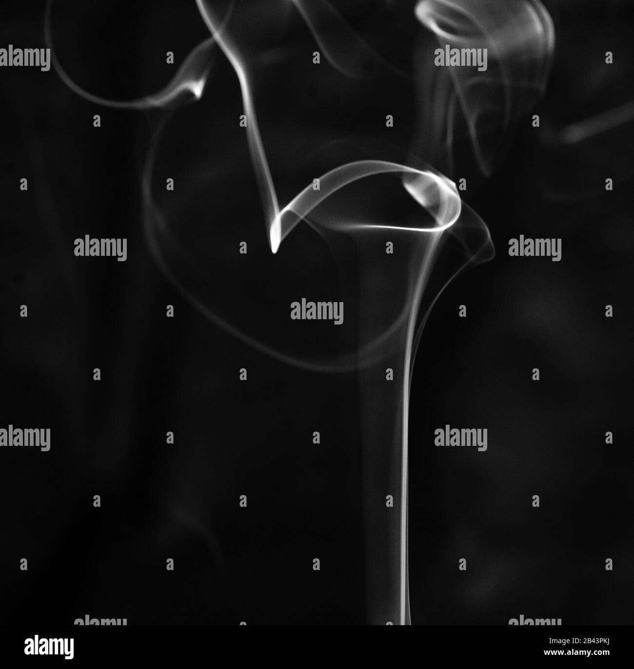 Incense smoke shot against a black background Stock Photo - Alamy