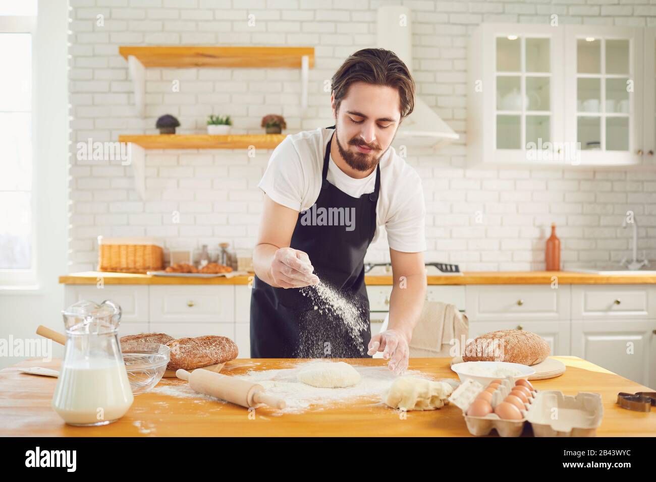 Baker in bakery making bread hi-res stock photography and images - Alamy