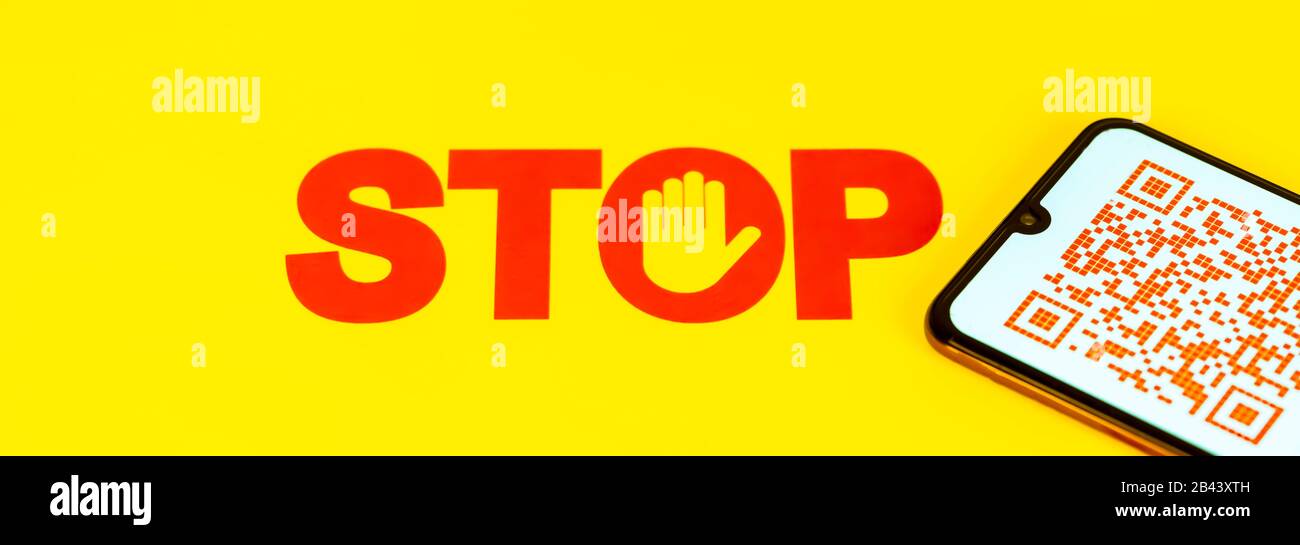 STOP Sign with red colorful QR Code on smart phone screen for ...