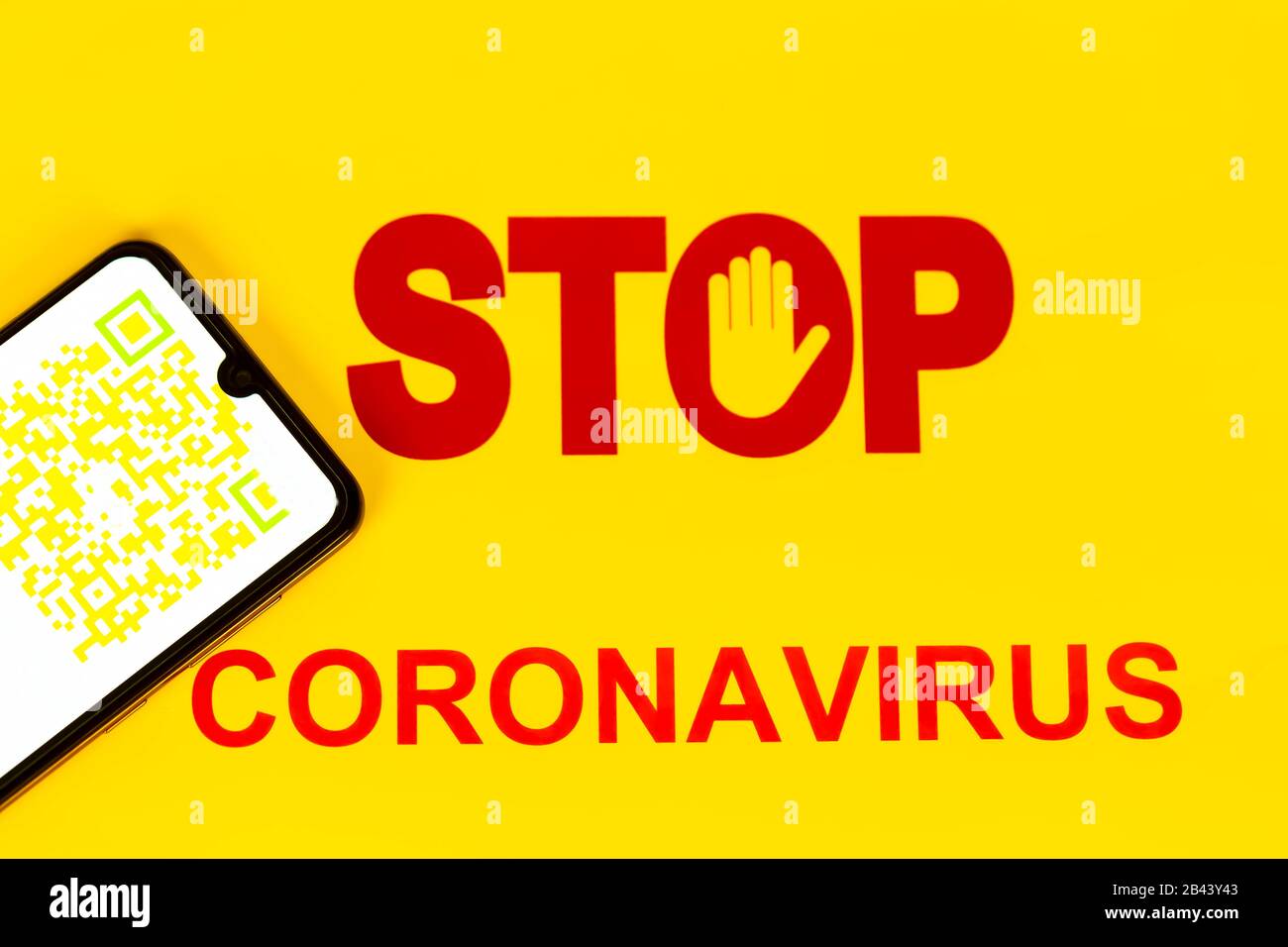 STOP Sign with yellow colorful QR Code on smart phone screen for ...