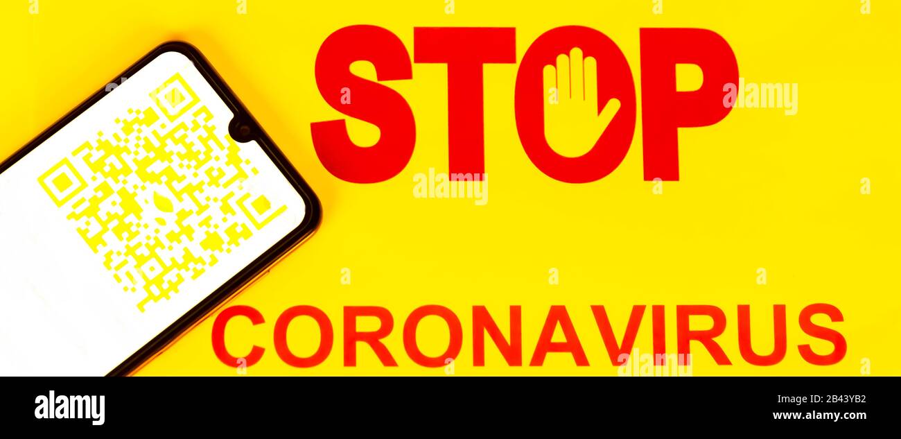 STOP Sign with yellow colorful QR Code on smart phone screen for ...