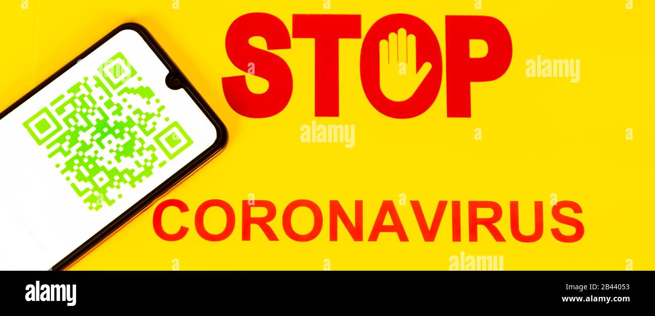 STOP Sign with green colorful QR Code on smart phone screen for ...
