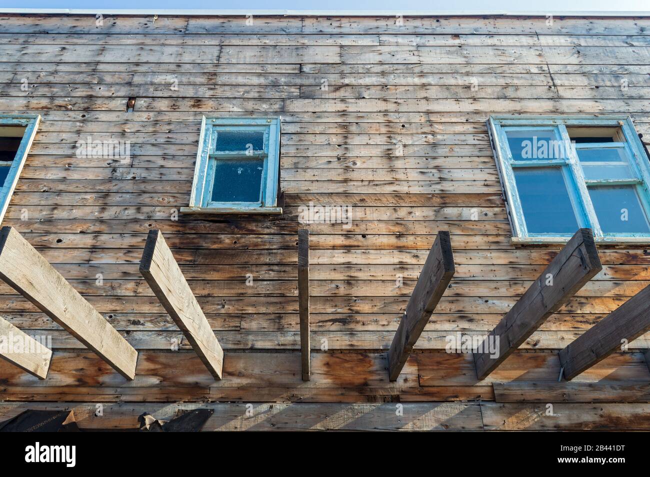 Faded facade of an abandoned building Stock Photo - Alamy