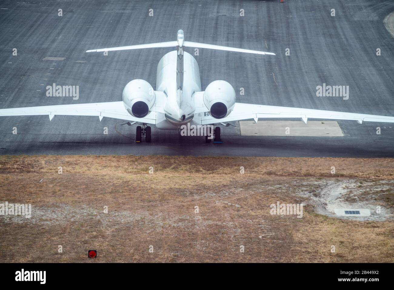 Aerial view of airplane ready to take off on airport runway Stock Photo ...