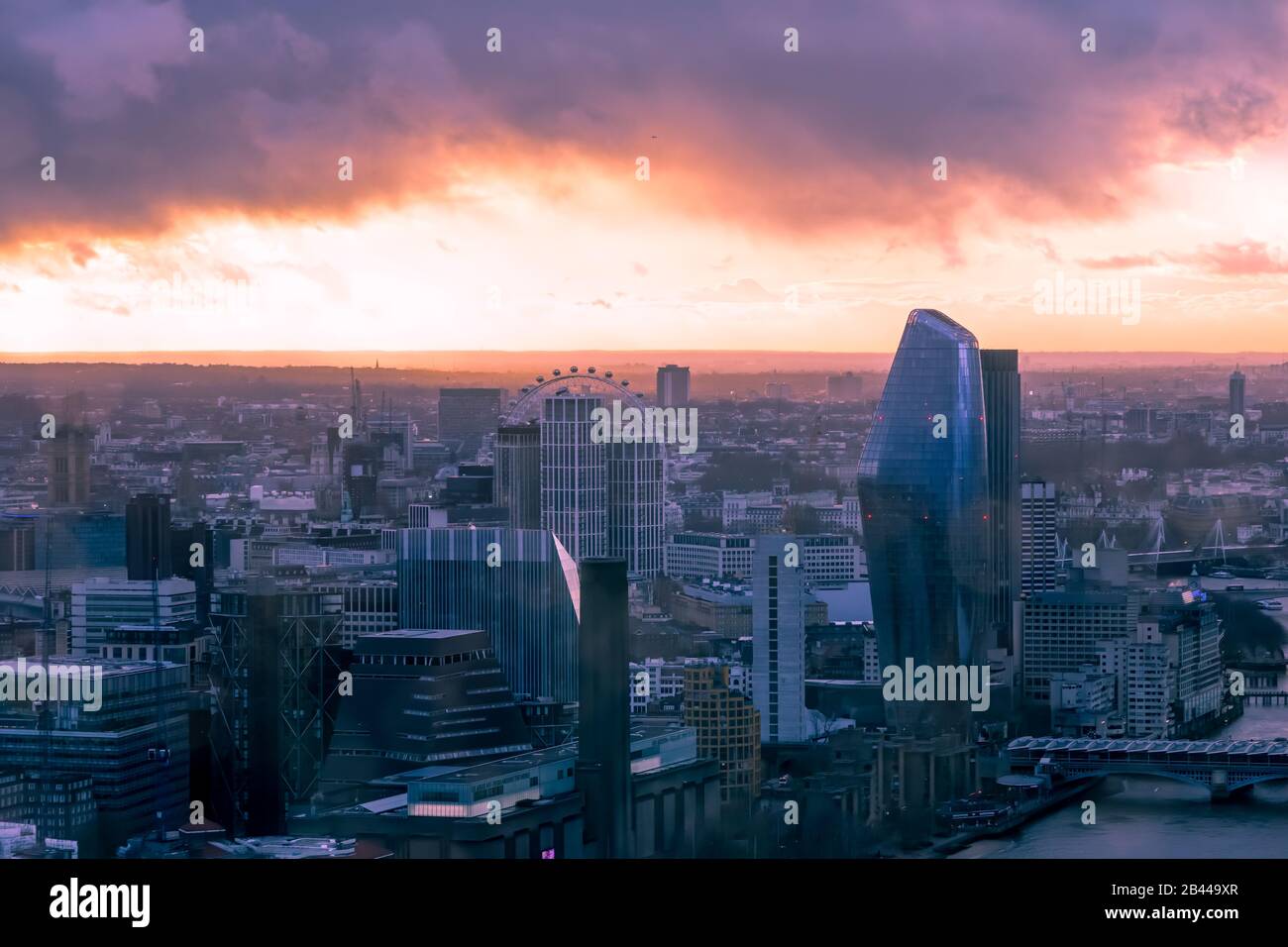 Hazy, menacing sky above London cityscape at sunset with a dystopian ...