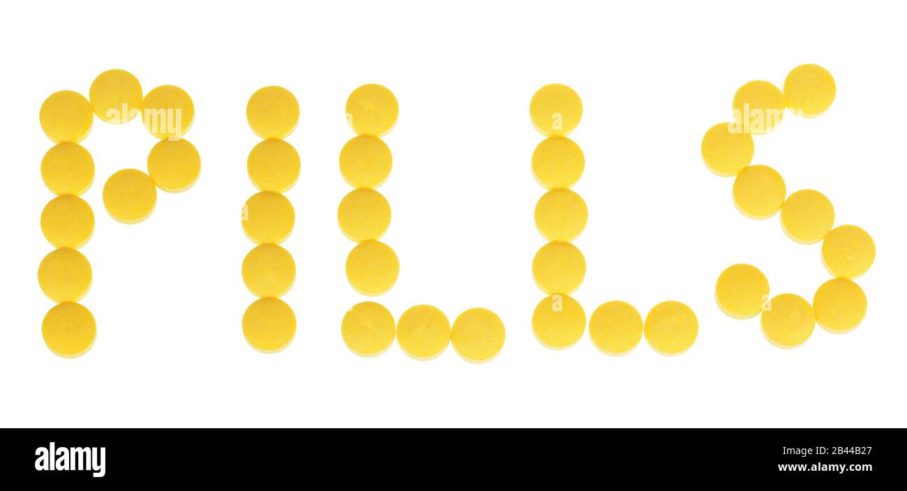 yellow vitamin pills isolated on white background Stock Photo - Alamy