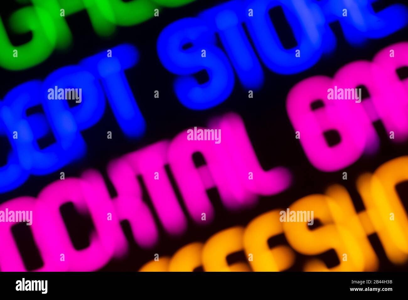 Neon background. Neon signs and words of different colors at night on ...