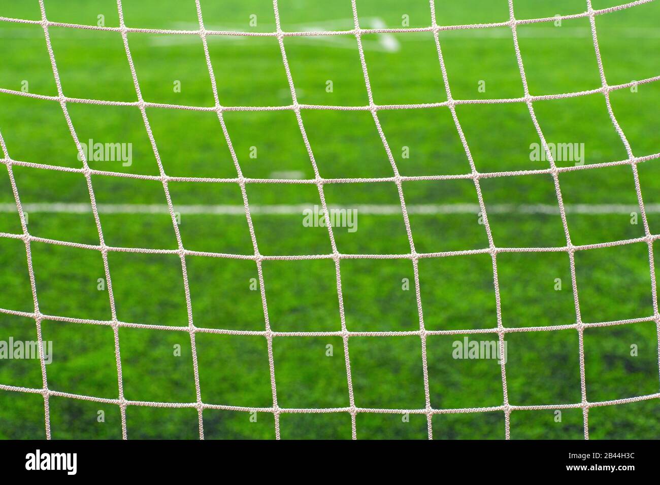 Soccer (football) field close up. Sports net at the football goal ...