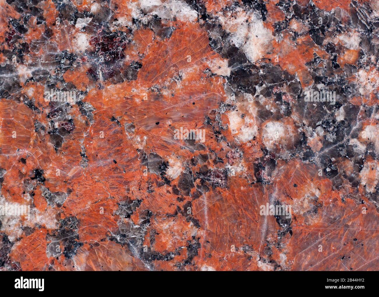 Granite texture. Reddish-brown base with black and gray spots. Used as ...