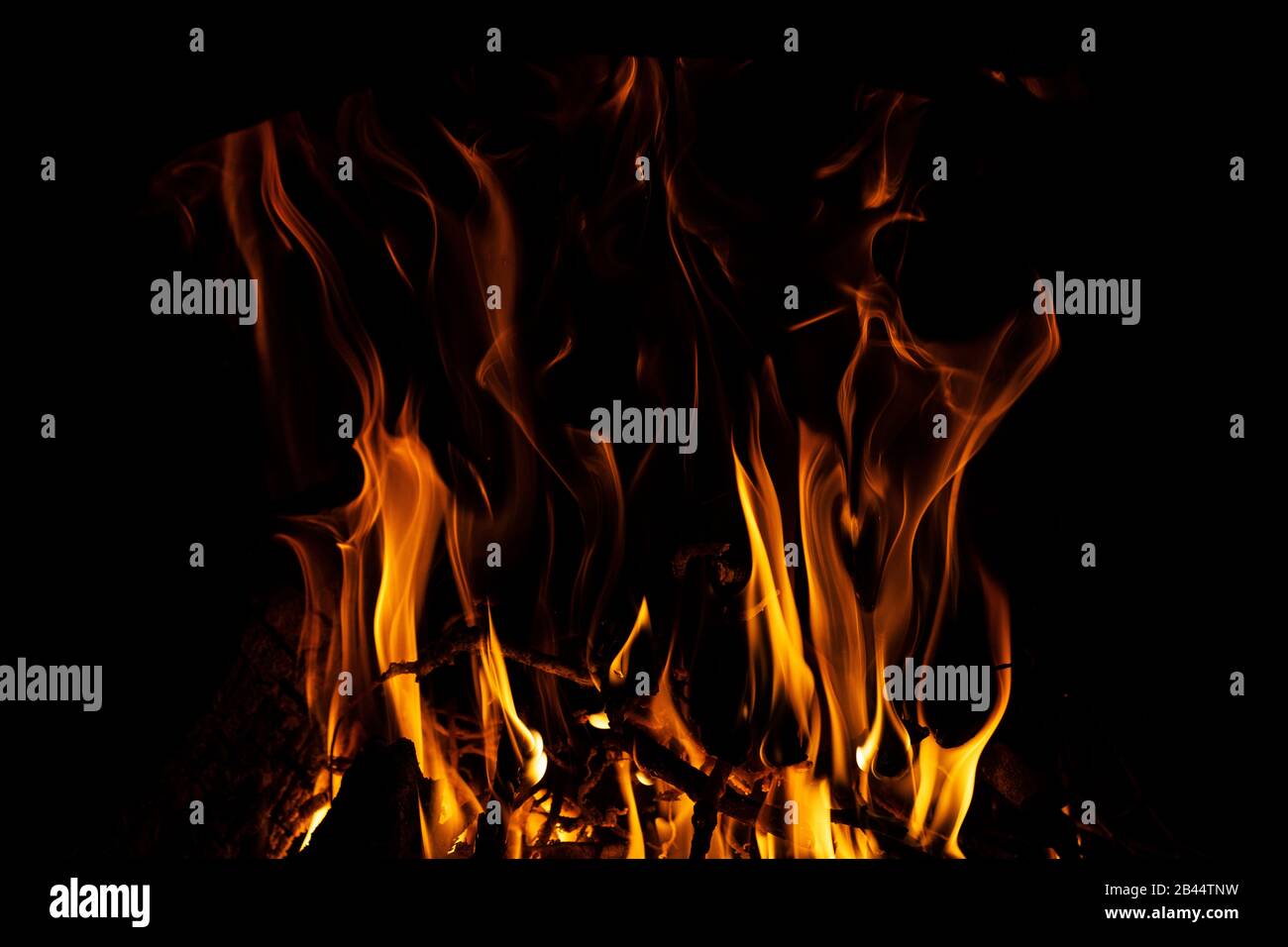 flame of fire stretches up in the dark Stock Photo - Alamy