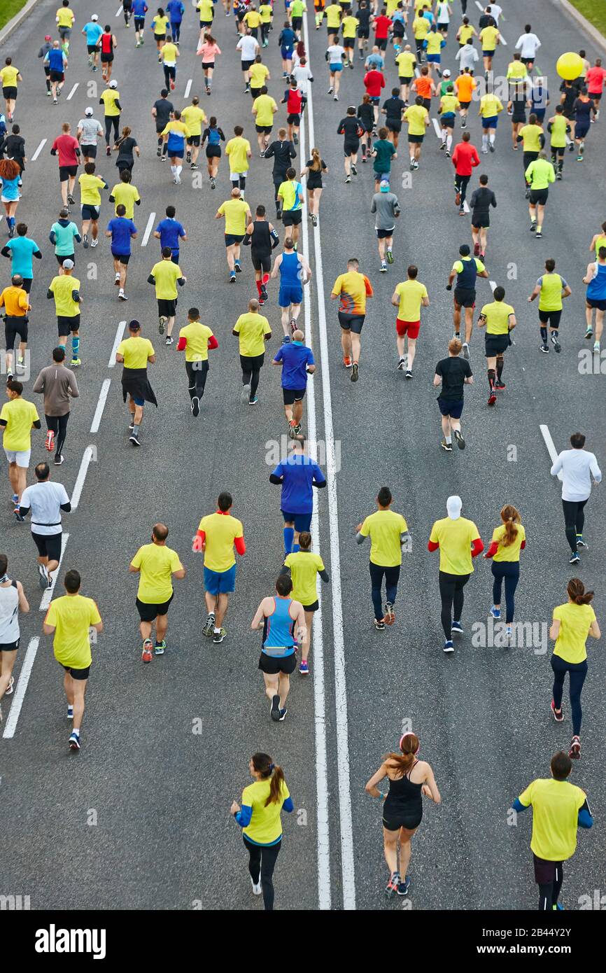 Marathon runners on the street. Healthy lifestyle. Athletes endurance ...