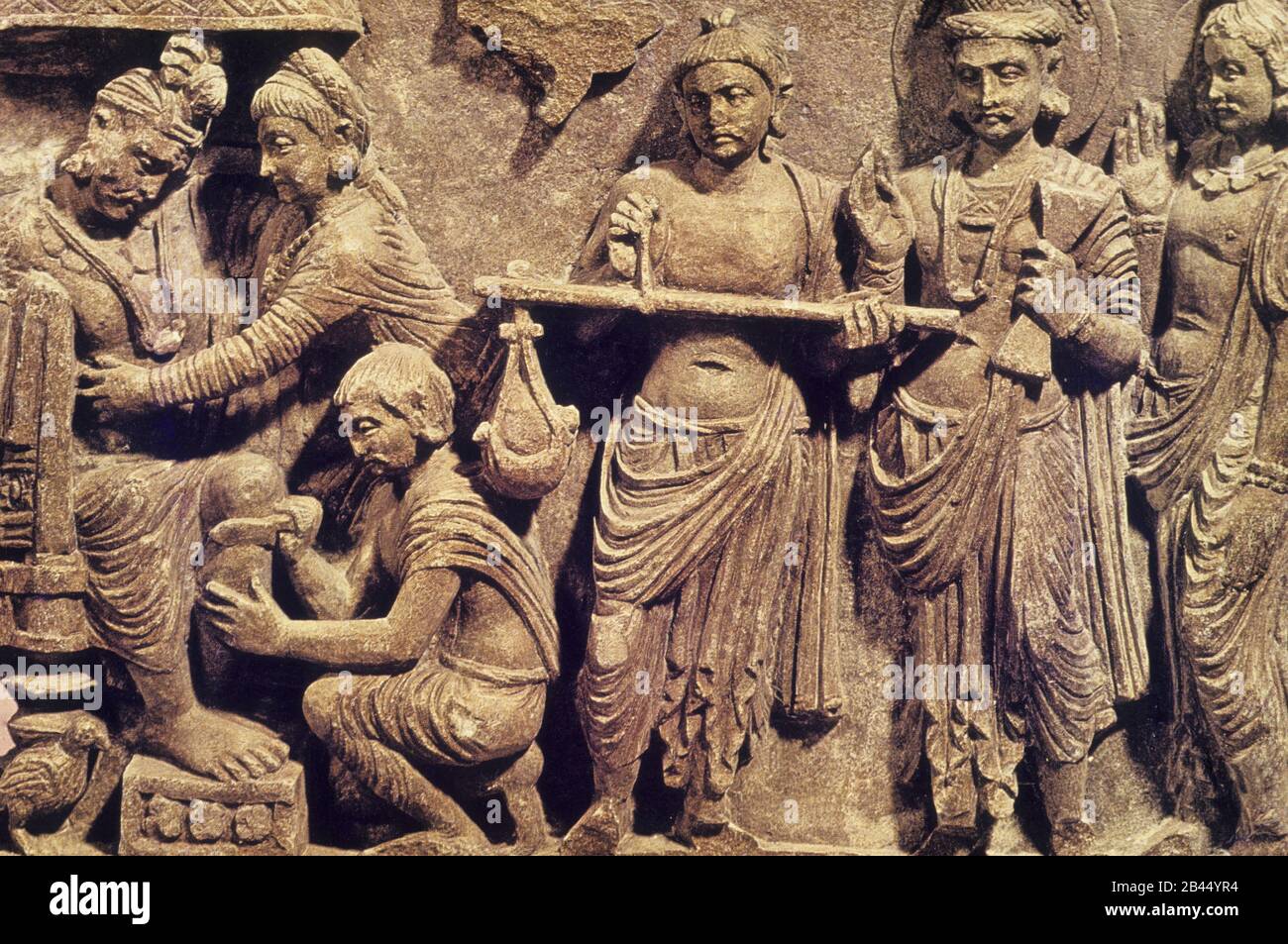 Wall relief showing an India, Asian surgeon operating on man leg, India ...