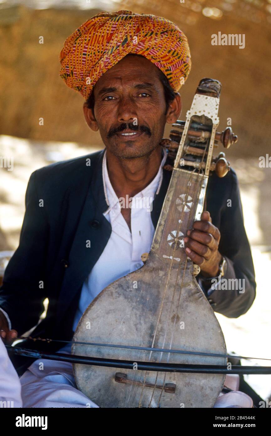 Rajasthani musicians playing kamayacha in shilpgram at Rajasthan, India ...