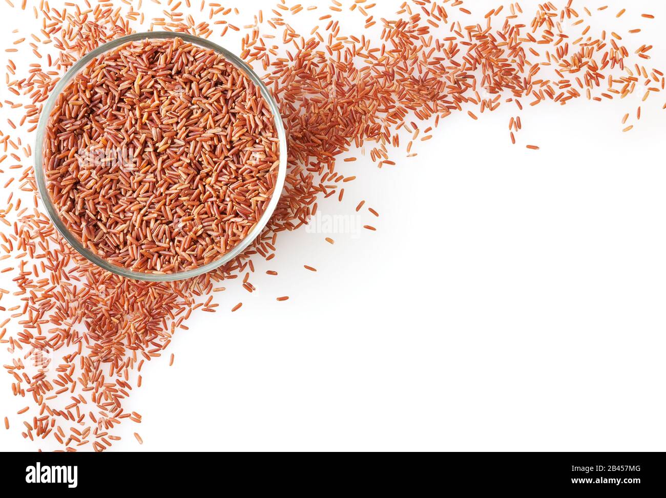 Uncooked red rice in glass bowl on white background` Stock Photo - Alamy