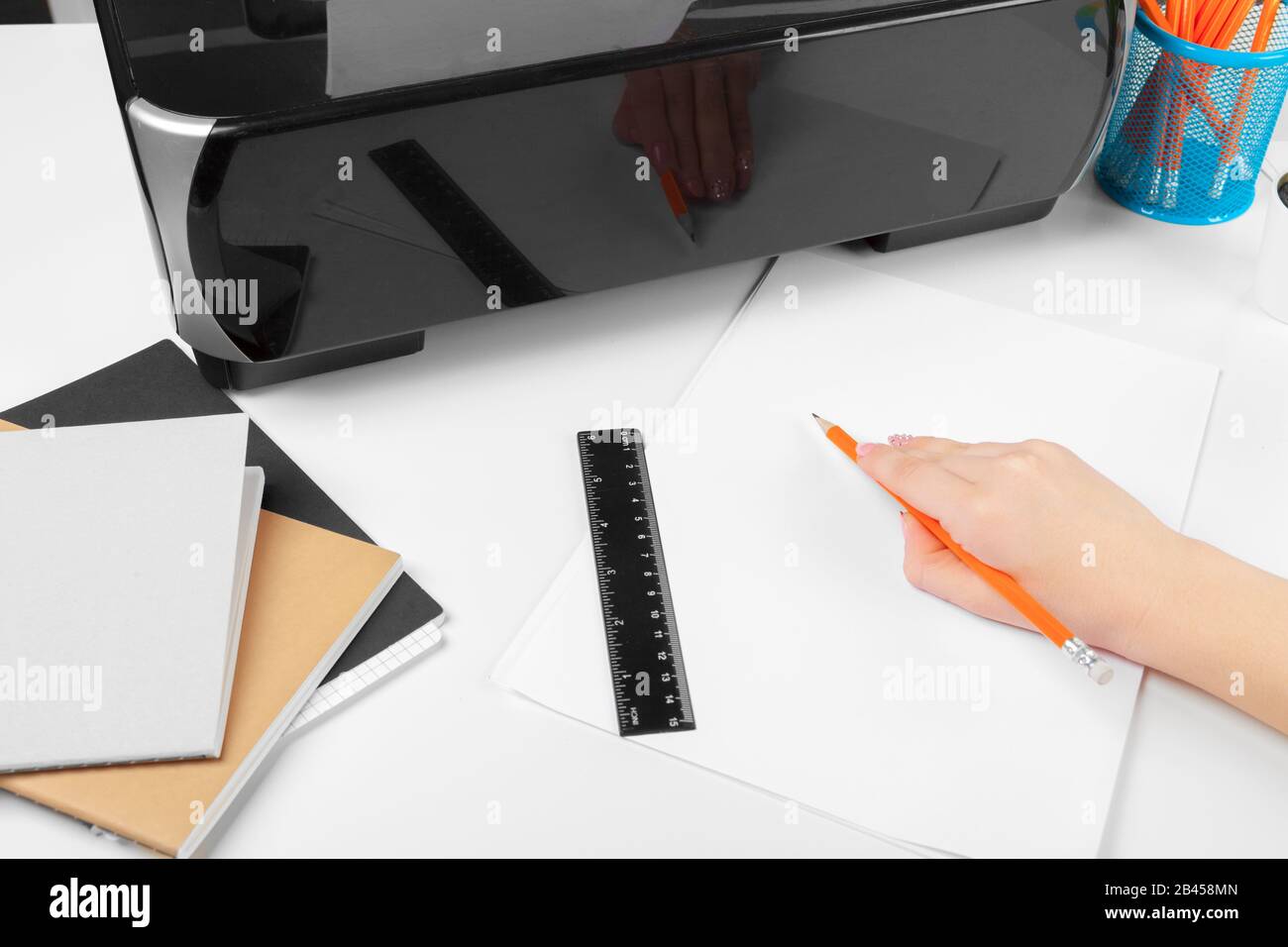 Woman using the printer to scanning and printing document Stock Photo ...