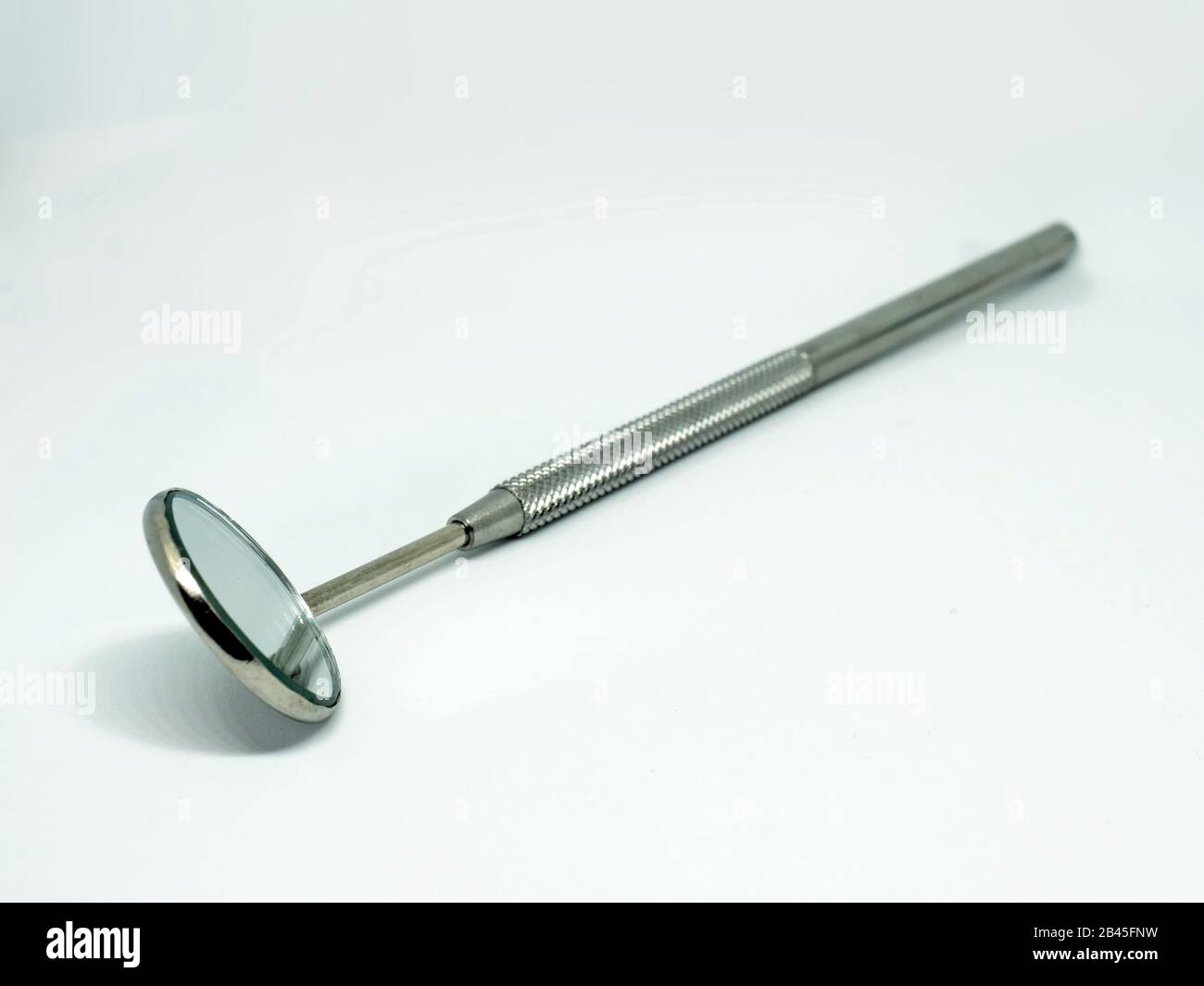 Dental mirror on white, health dental hygiene tool Stock Photo - Alamy