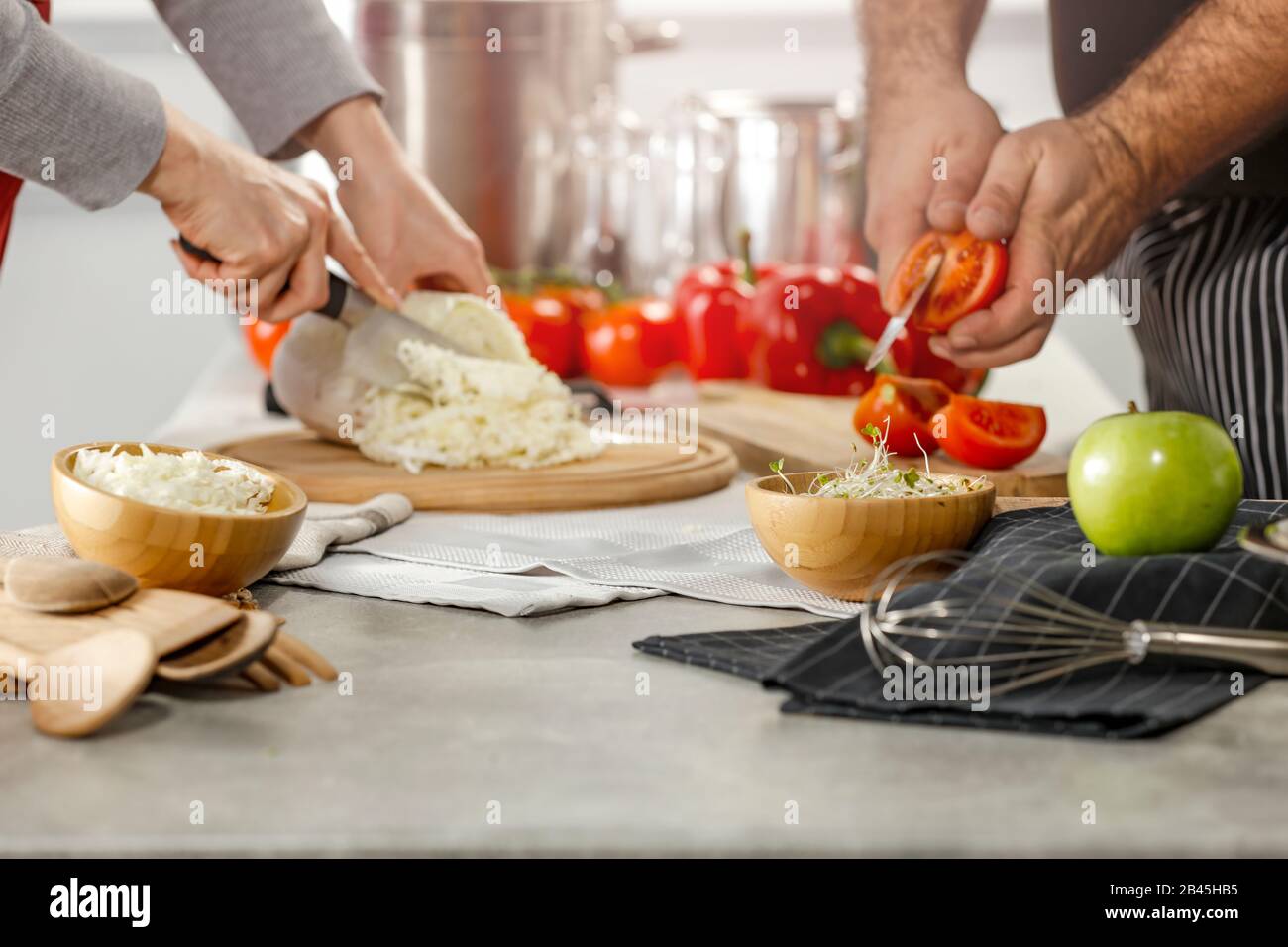 Cooking, baking and preparing meals and dishes in the kitchen. Table ...