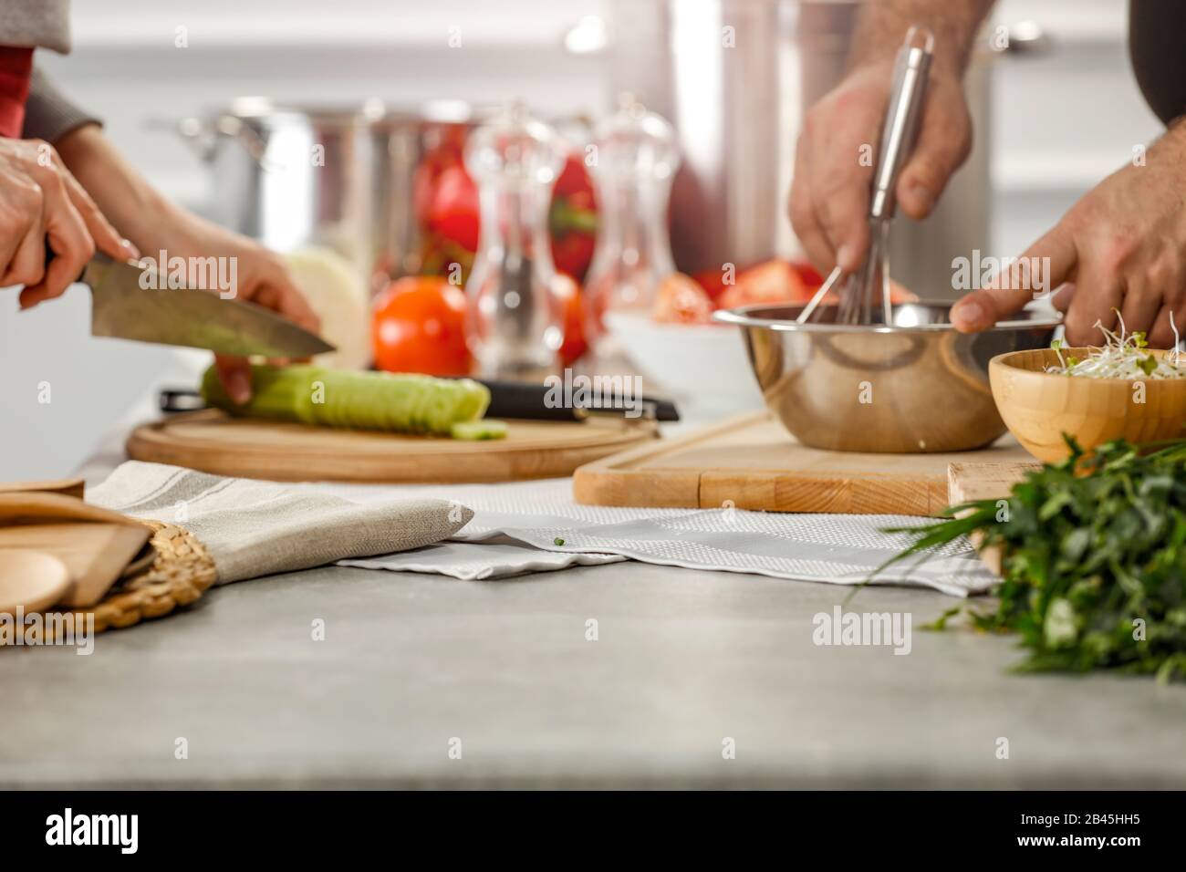 Cooking, baking and preparing meals and dishes in the kitchen. Table ...