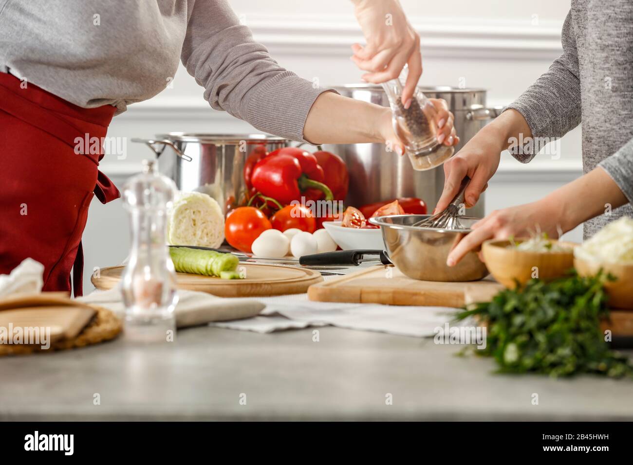 Cooking, baking and preparing meals and dishes in the kitchen. Table ...