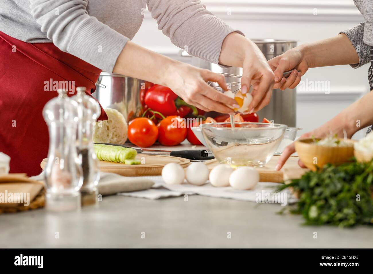 Cooking, baking and preparing meals and dishes in the kitchen. Table ...