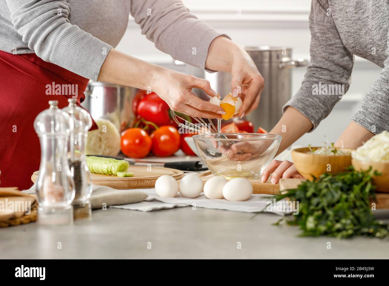 Cooking, baking and preparing meals and dishes in the kitchen. Table ...
