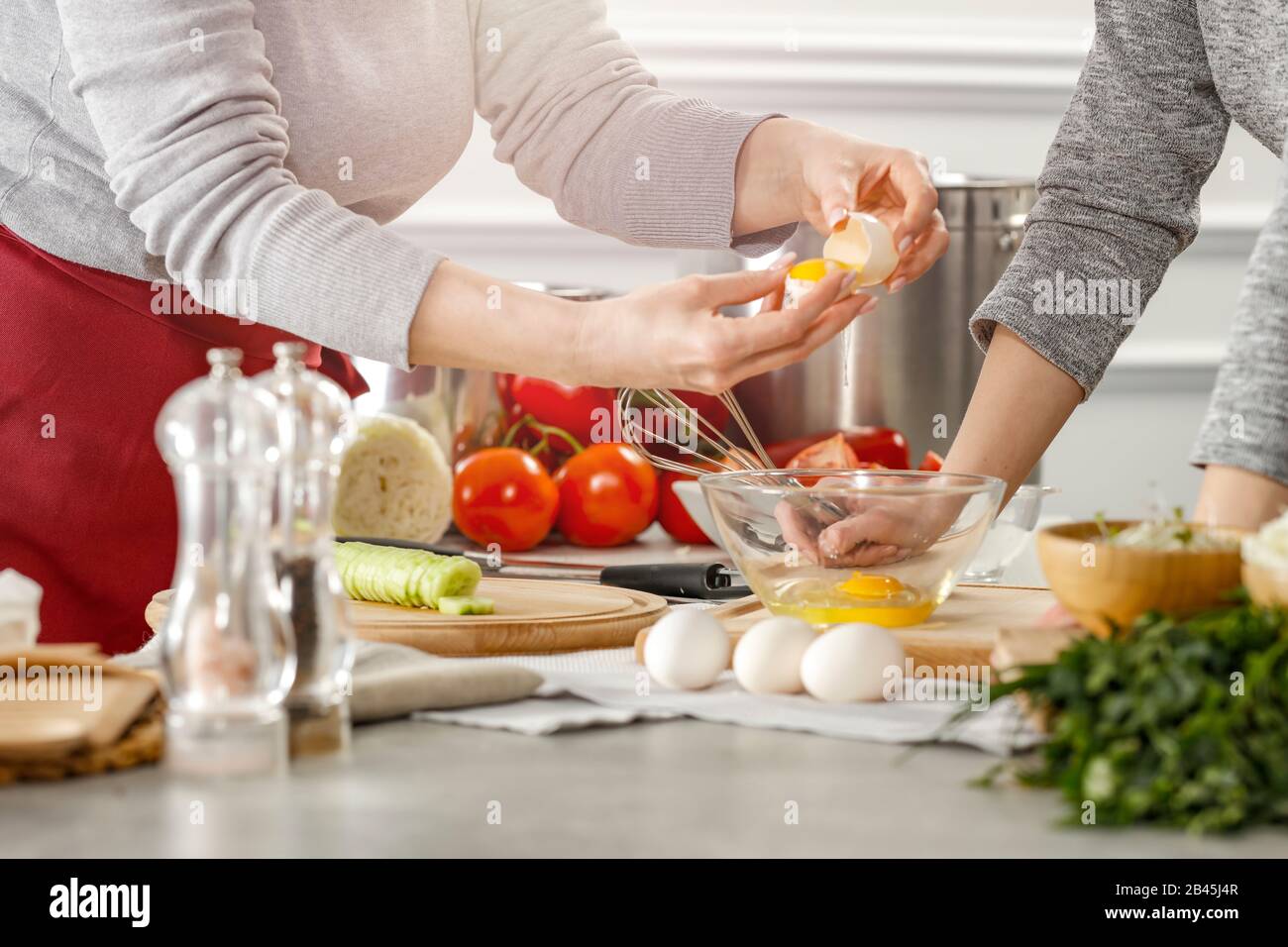 Cooking, baking and preparing meals and dishes in the kitchen. Table ...