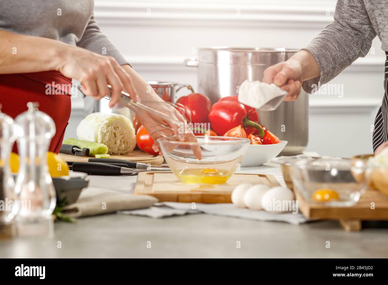 Cooking, baking and preparing meals and dishes in the kitchen. Table ...