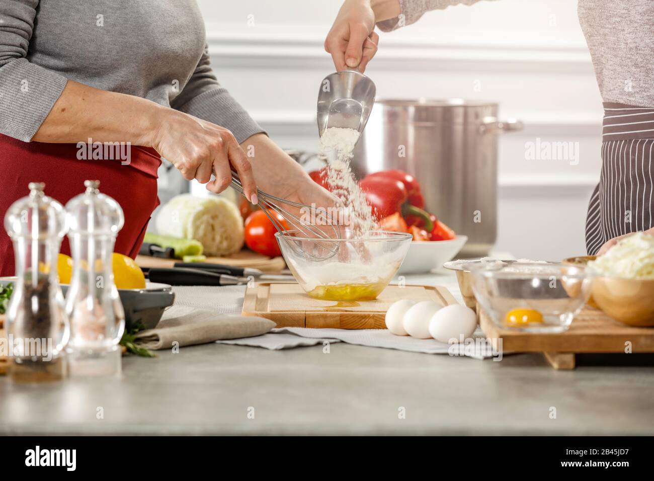 Cooking, baking and preparing meals and dishes in the kitchen. Table ...