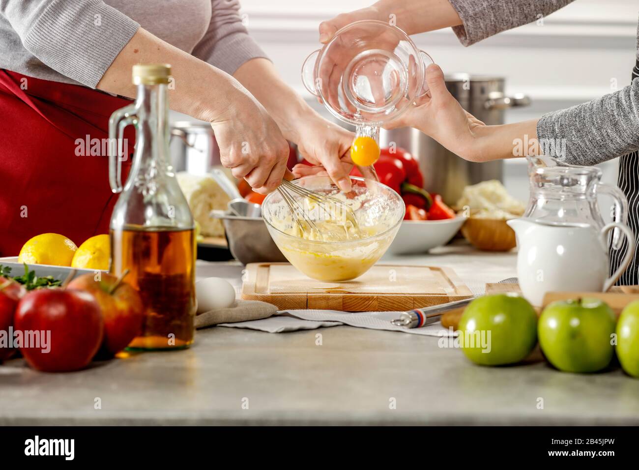 Cooking, baking and preparing meals and dishes in the kitchen. Table ...