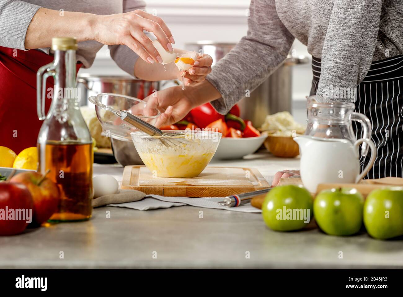 Cooking, baking and preparing meals and dishes in the kitchen. Table ...