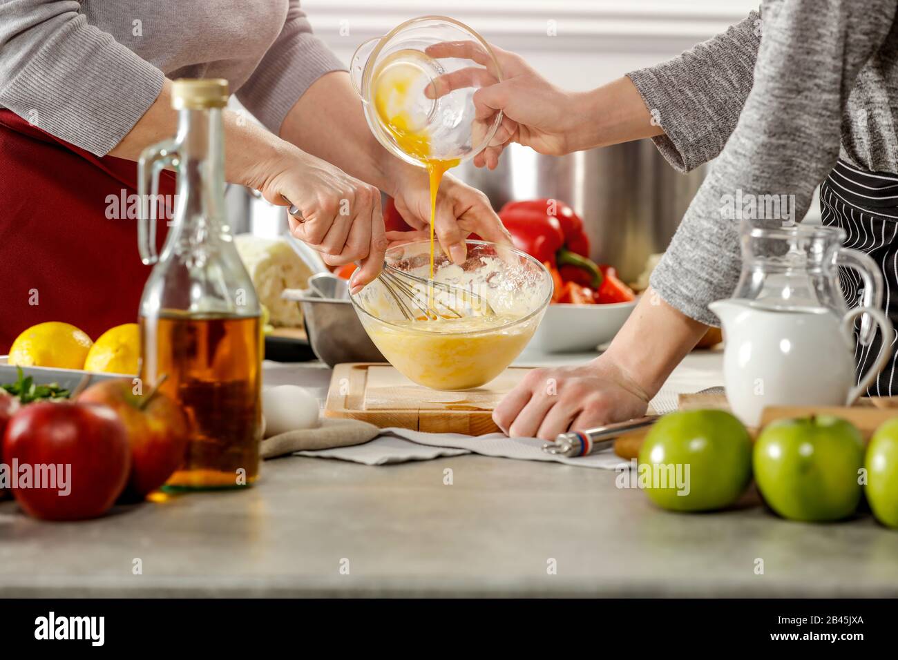 Cooking, baking and preparing meals and dishes in the kitchen. Table ...
