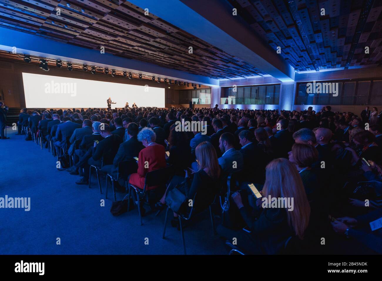 Conference hall full of audience and speakers on the stage Stock Photo ...