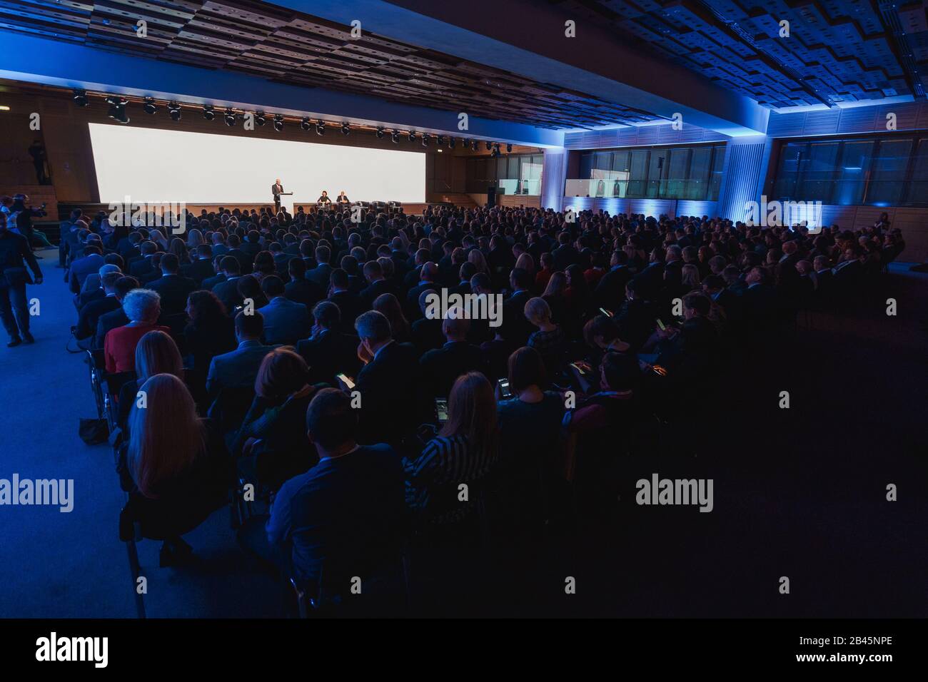 Conference hall full of audience and speakers on the stage Stock Photo ...