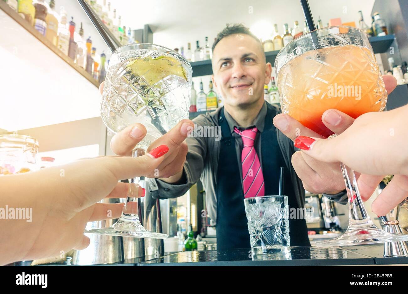 Pov prospective of young woman taking cocktails from professional ...