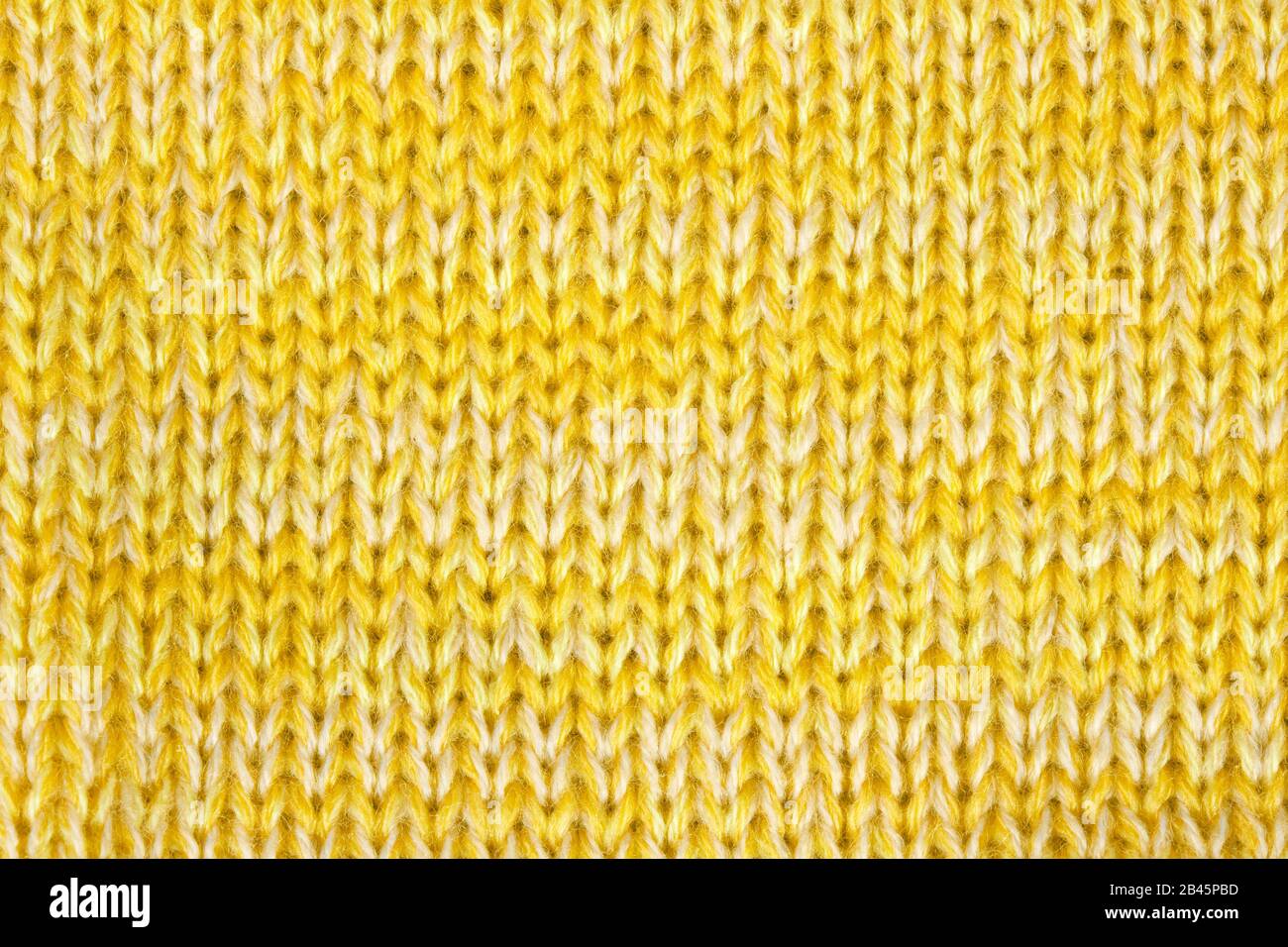 Yellow knitted textured background Stock Photo - Alamy