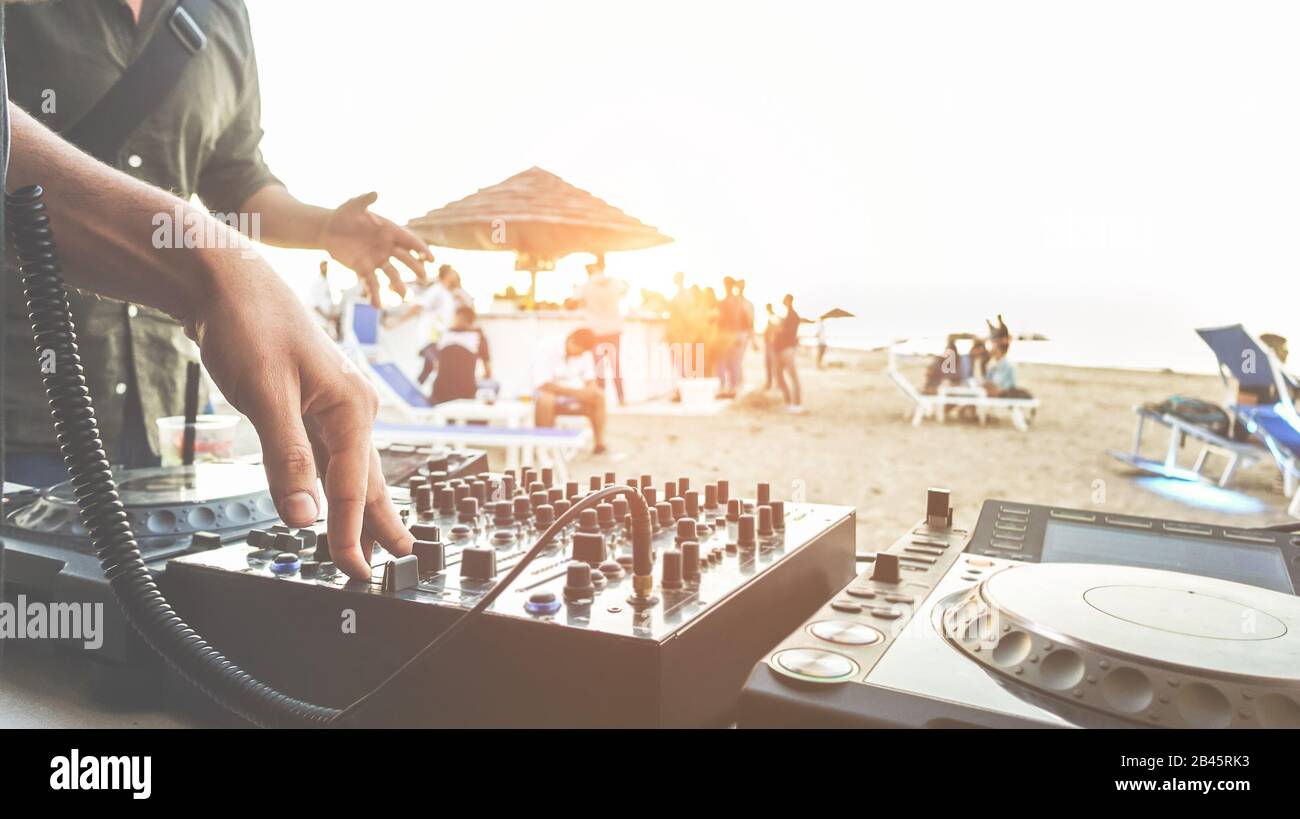 Dj mixing at sunset beach party in summer vacation outdoor - Disc ...