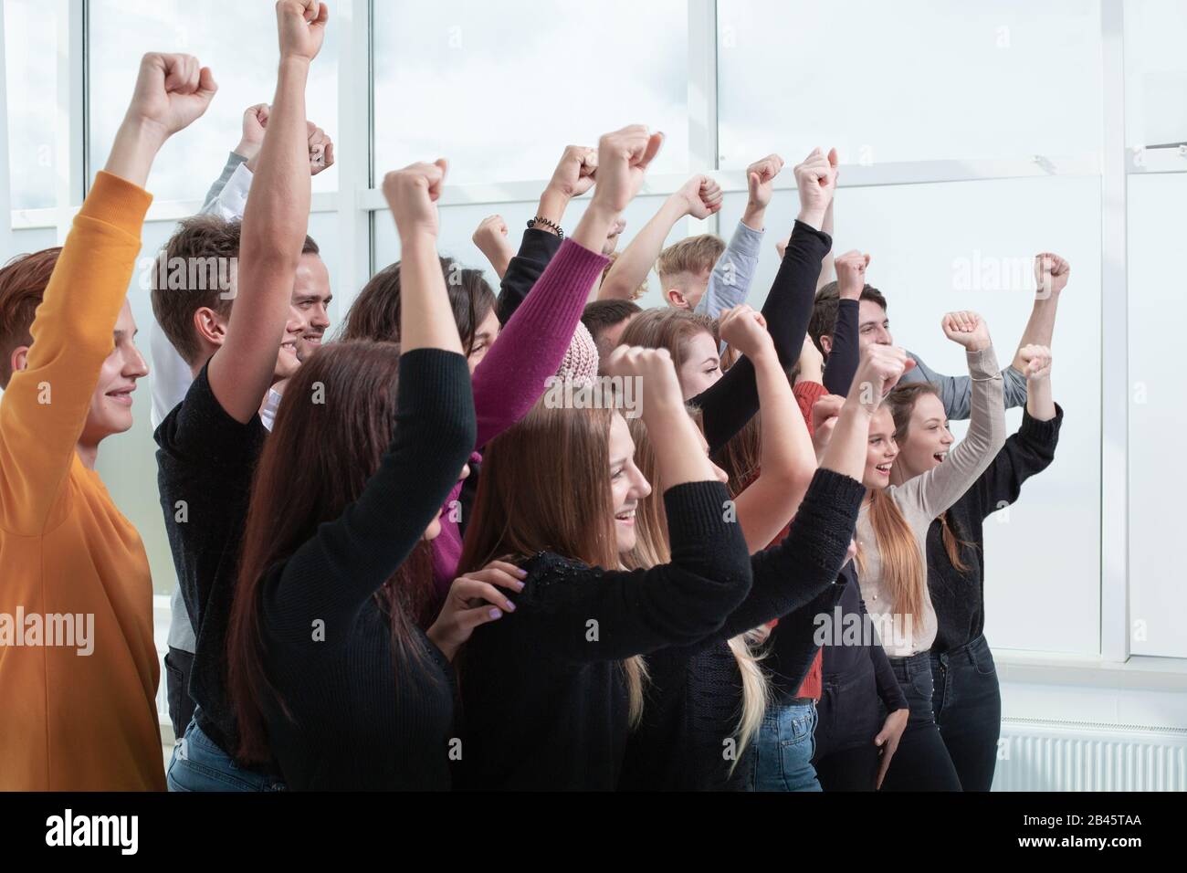 group of jubilant young people looking forward Stock Photo - Alamy