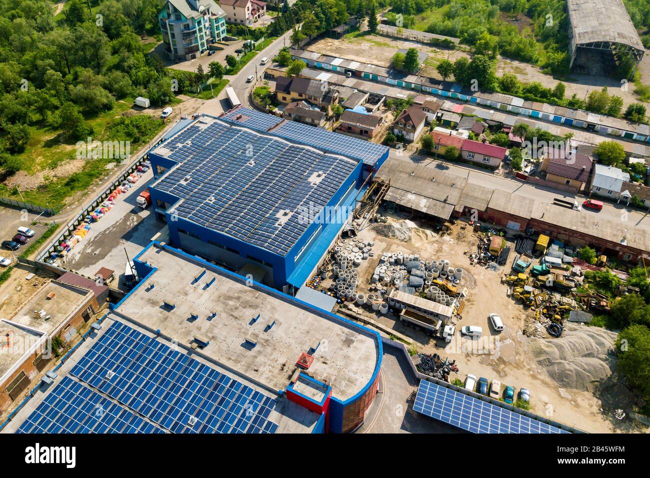Aerial view of many photo voltaic solar panels mounted of industrial ...